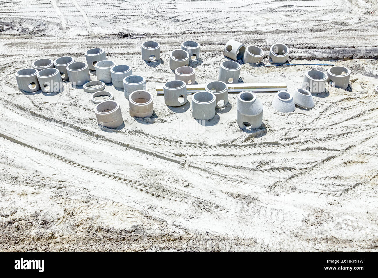 New concrete prefabricated pipes for manhole or drainage stacked at ...