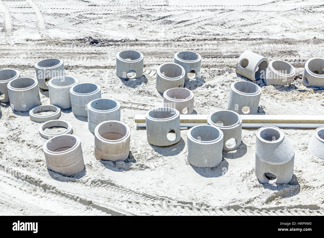 New concrete prefabricated pipes for manhole or drainage stacked at ...