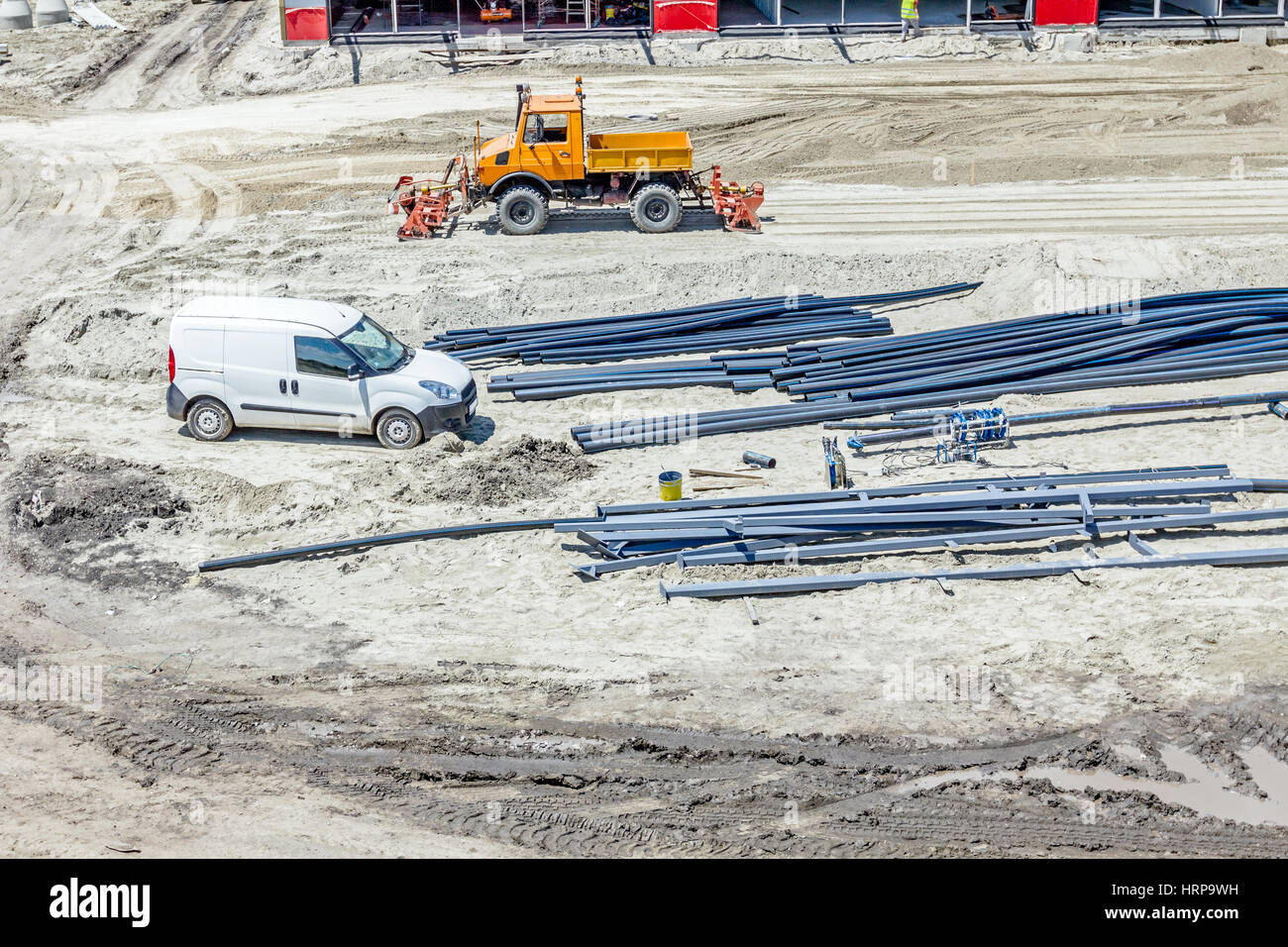 Above view on the pickup car, small truck and pipes are on a ...