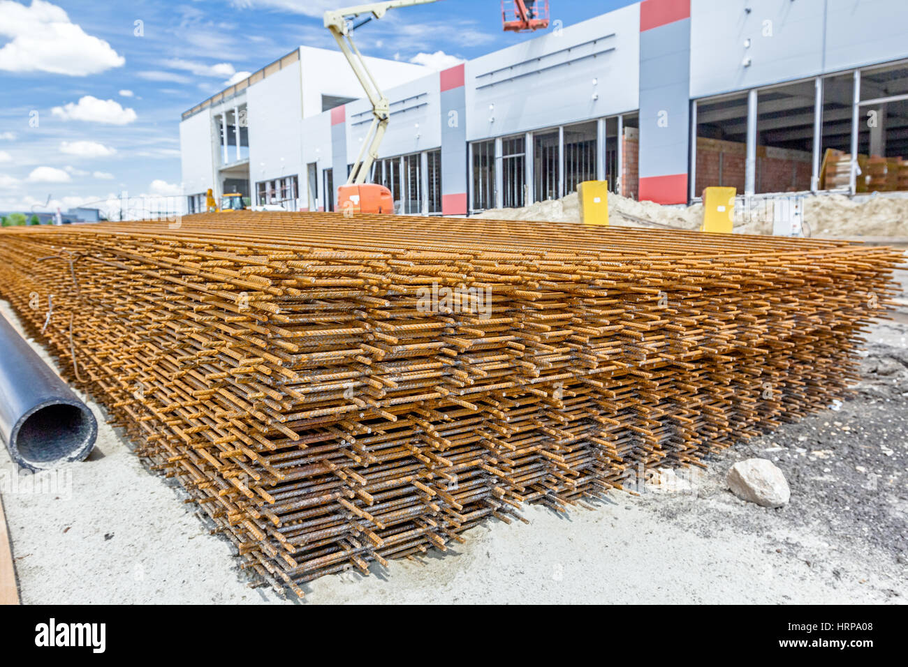 View on rusty square reinforcement for concrete, construction site is ...