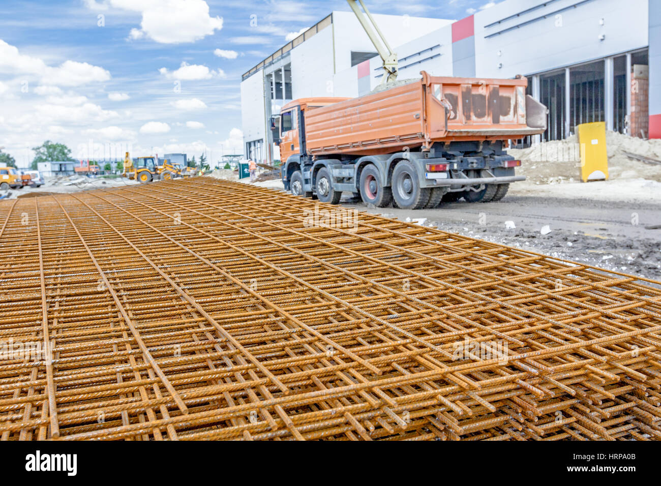 View on rusty square reinforcement for concrete, construction site is ...