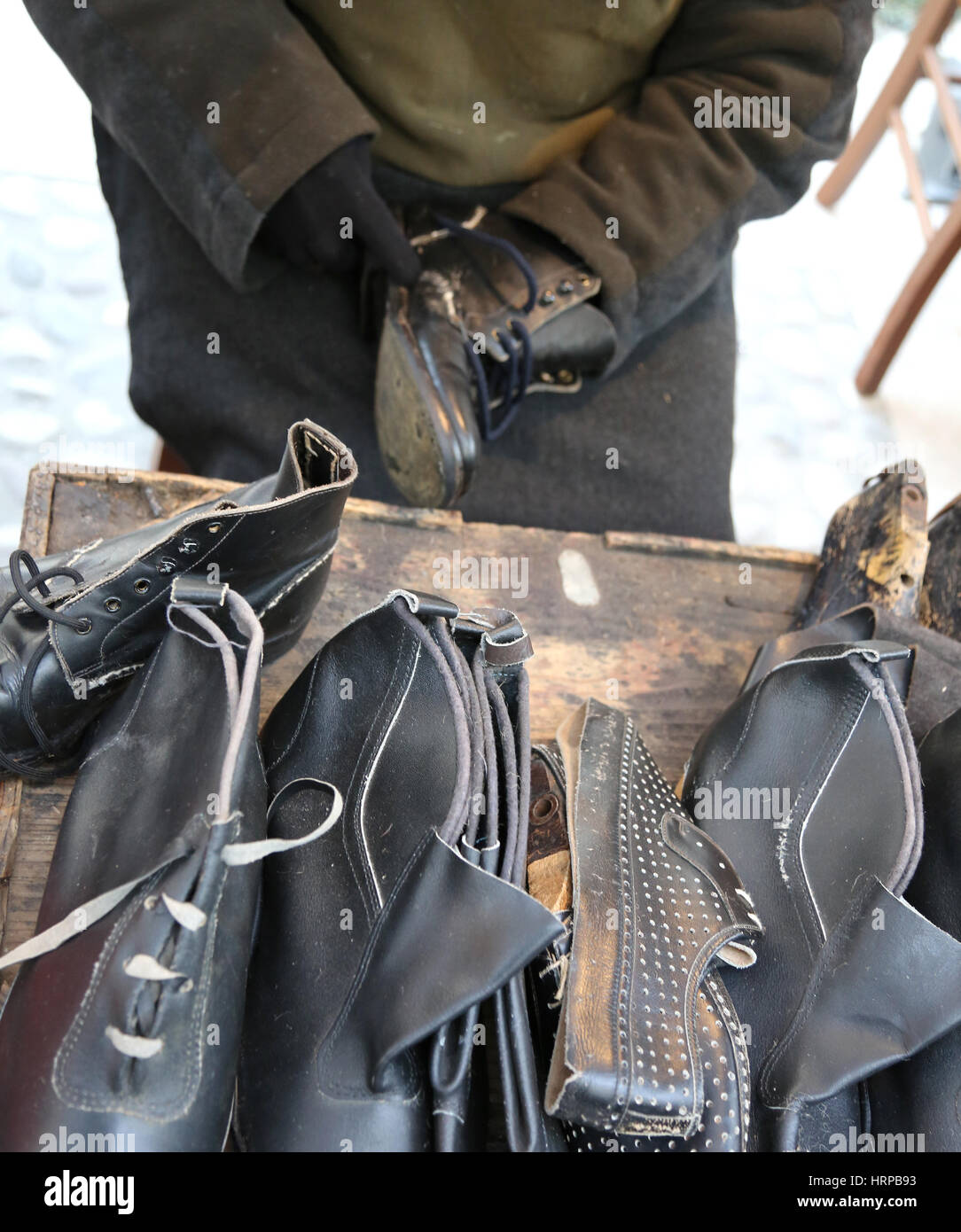 senior expert shoemaker while repairing an old leather shoe Stock Photo ...