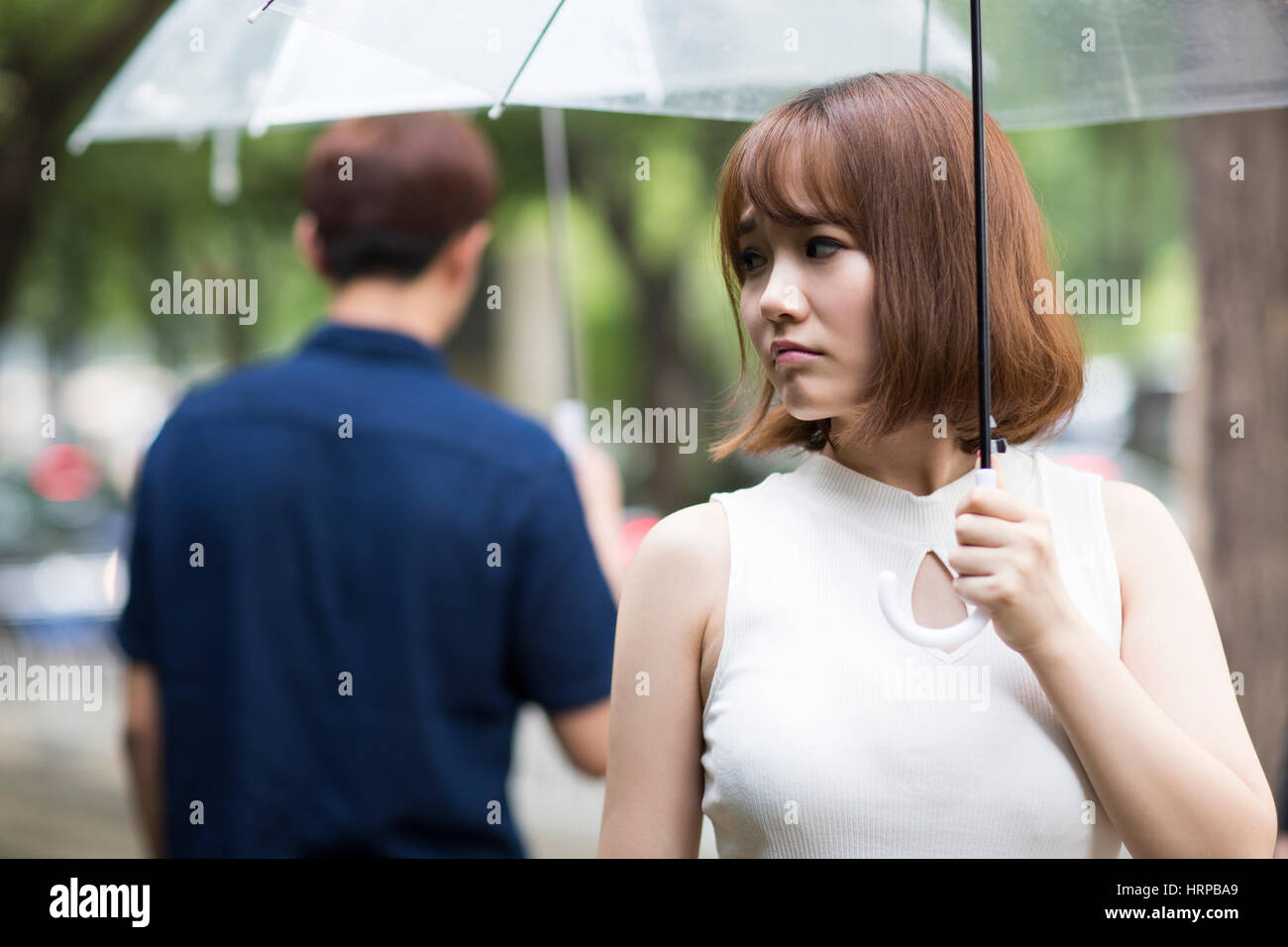 Serious couple standing back hi-res stock photography and images - Alamy