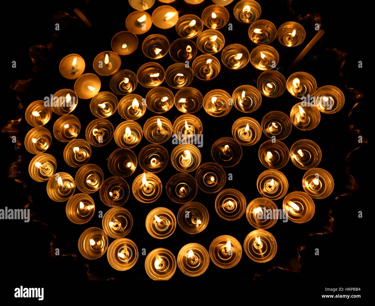 candles lit with the warm flame during the religious ceremony Stock ...