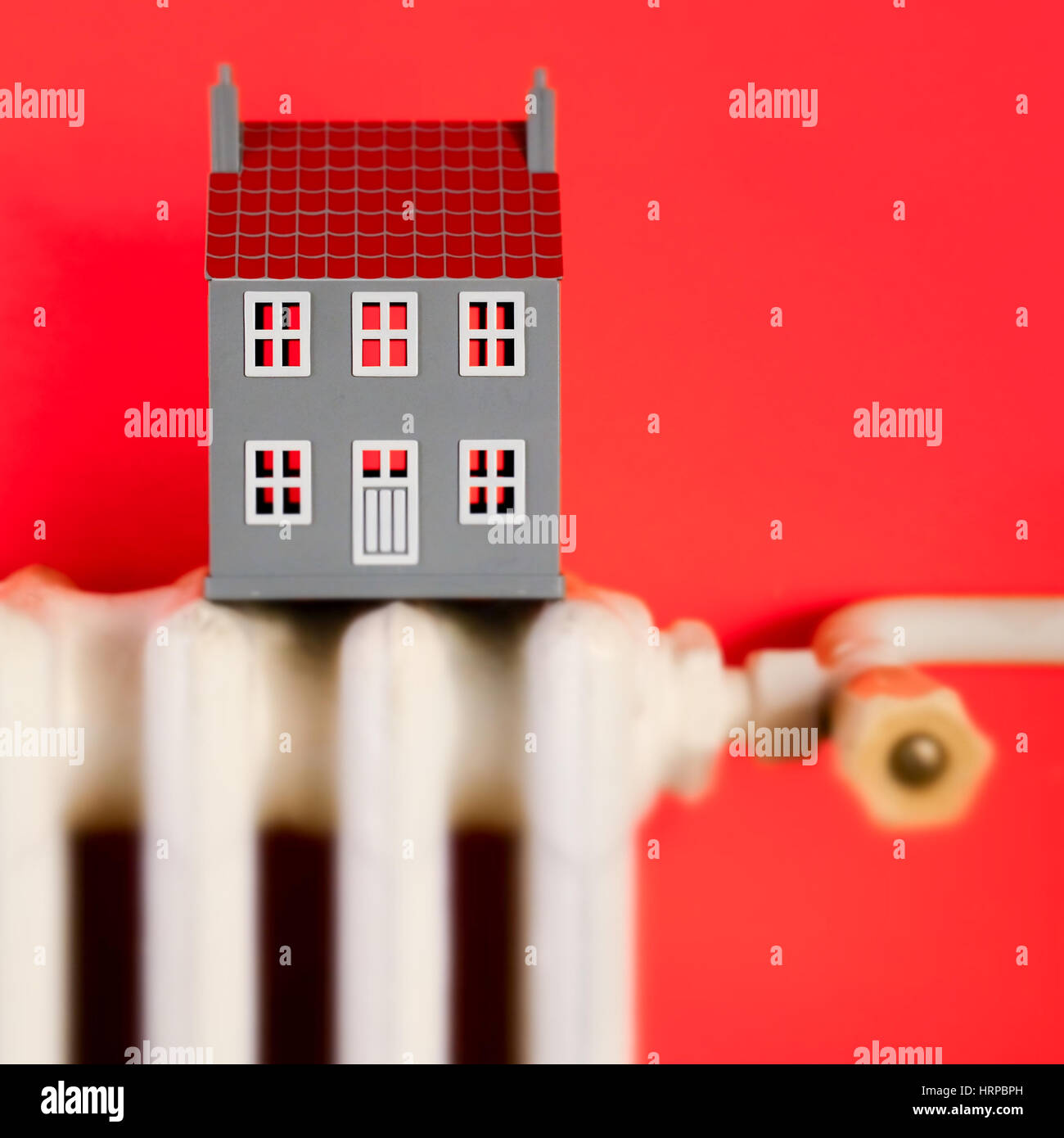 Conceptual image on the heat consumption of a house Stock Photo - Alamy