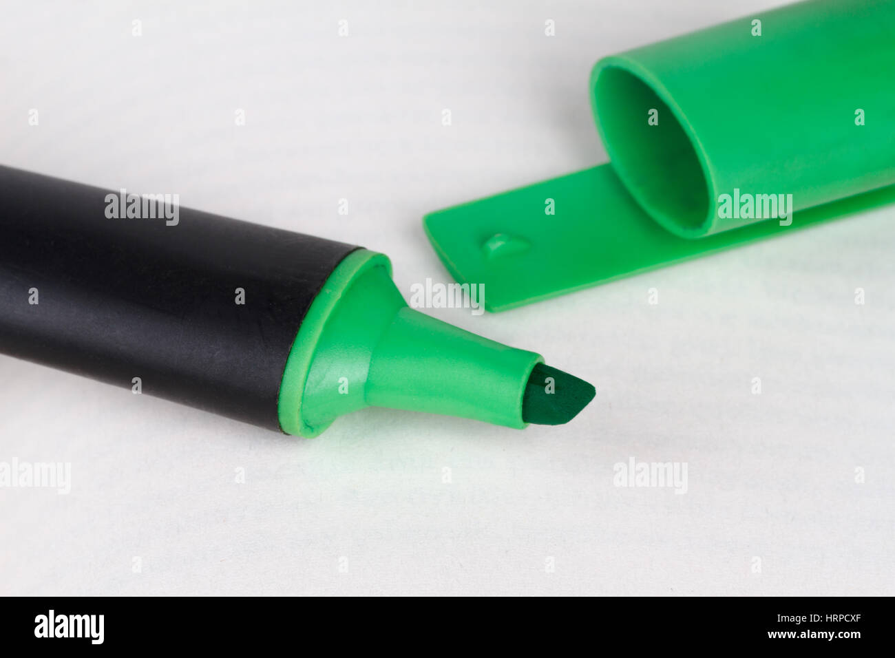 Close up detailed side view of green highlighter pen on paper Stock ...