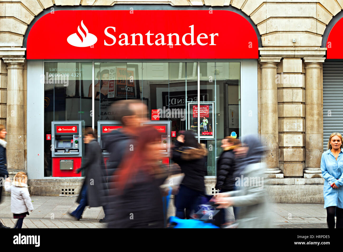 People walking past a branch of Santander on a UK high street Stock ...