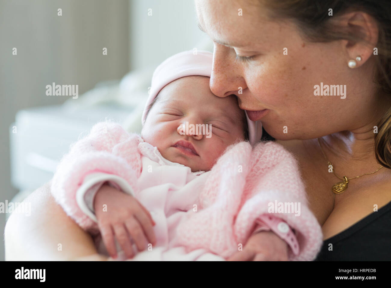 Mother with her one day baby girl Stock Photo - Alamy