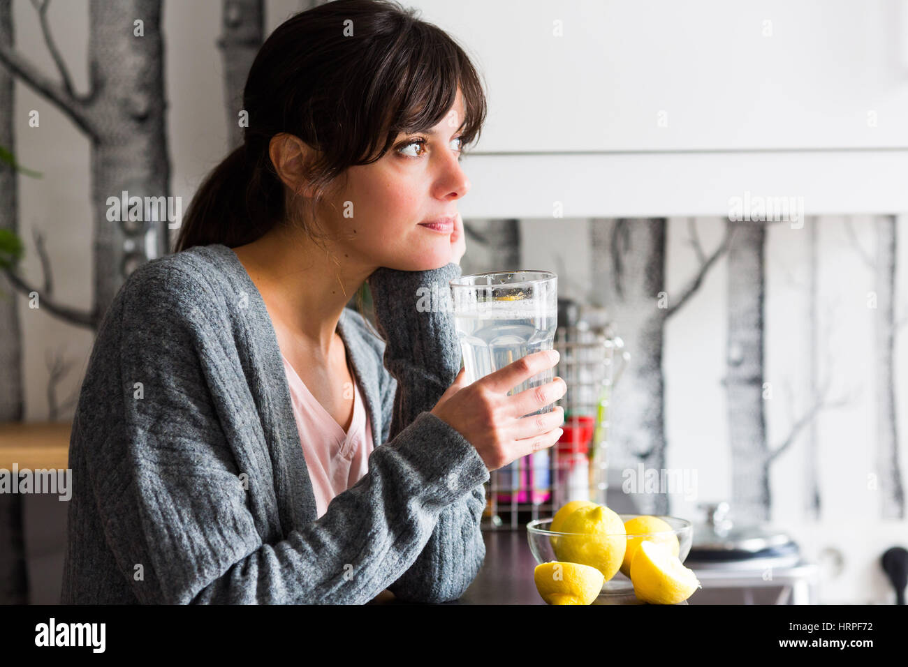 Woman drinking freshly squeezed lemon juice Stock Photo - Alamy