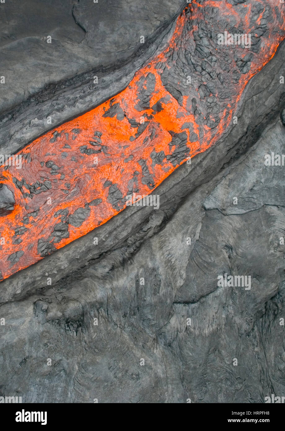 An aerial portrait view of a river of flowing molten volcanic magma ...