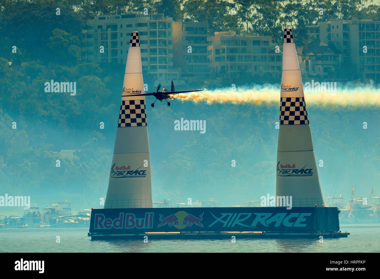 Aircraft with smoke flying between pylons, at the Red Bull Air Race ...
