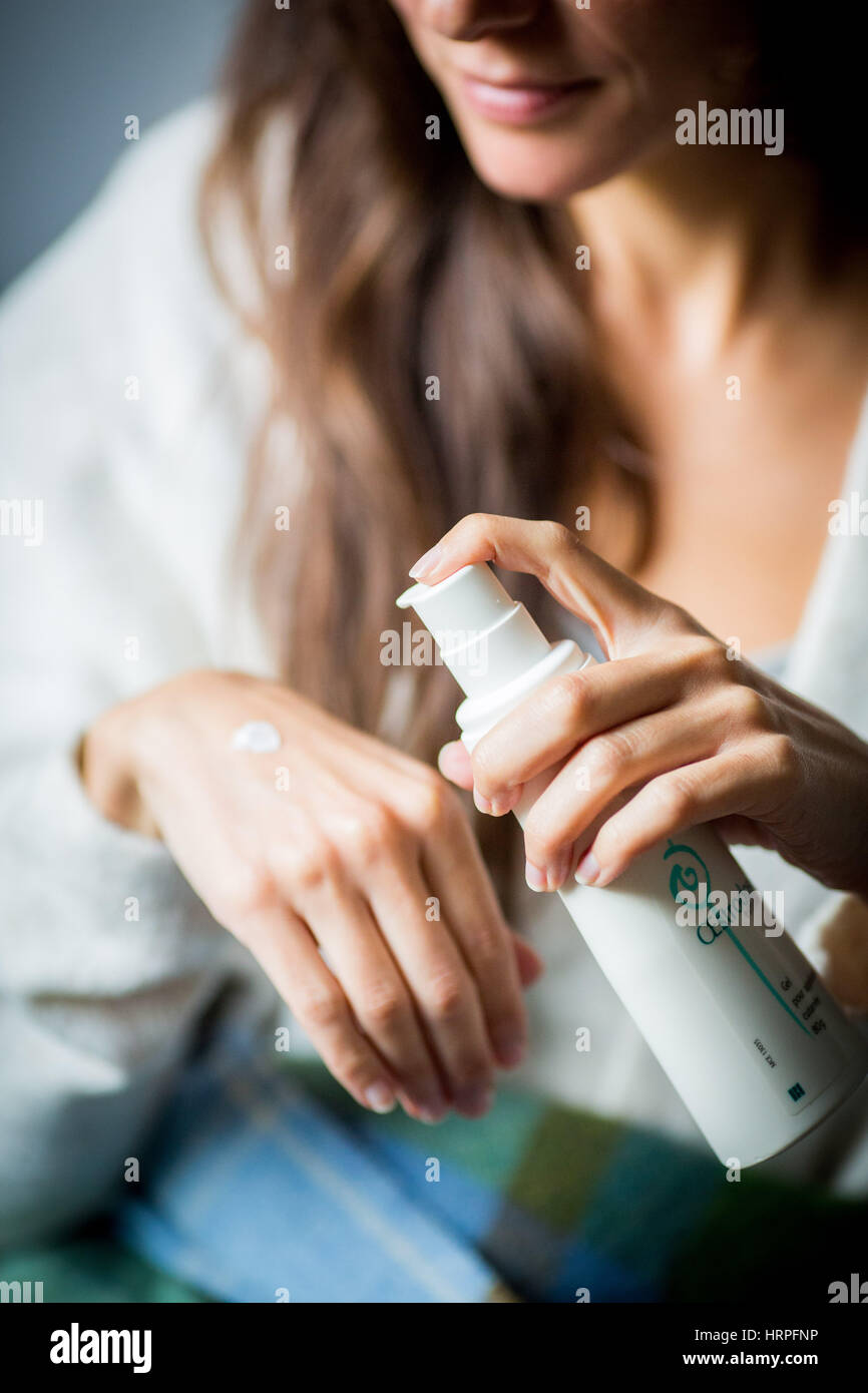 Woman applying estrogen gel on hi-res stock photography and images - Alamy