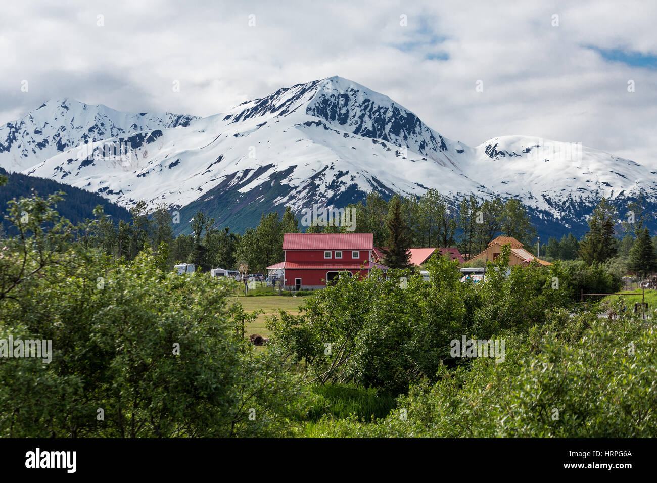 A Red Barn Under Alaskan Mountain Stock Photo - Alamy