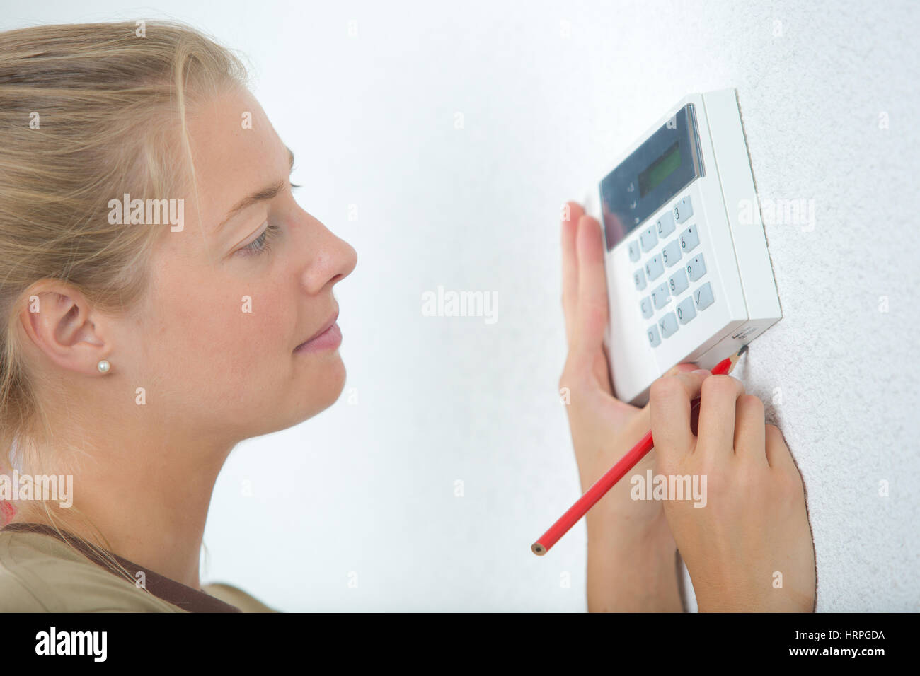 girl putting up keypad Stock Photo - Alamy