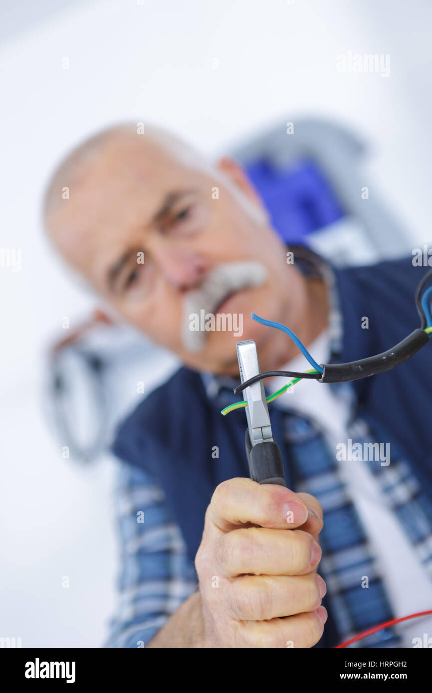 Hand holding electrical wires hi-res stock photography and images - Alamy