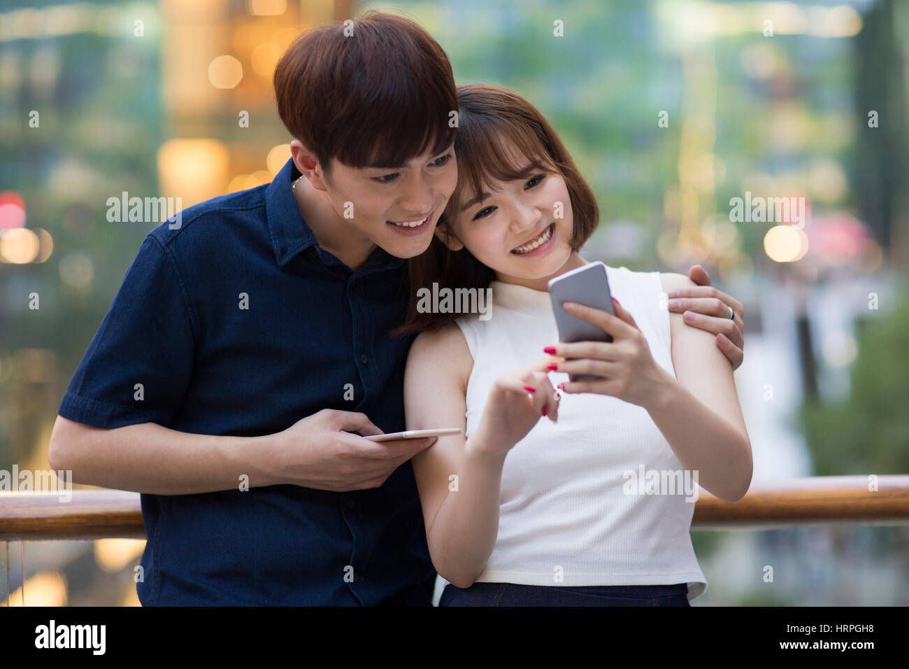 Using phones hand china hi-res stock photography and images - Alamy