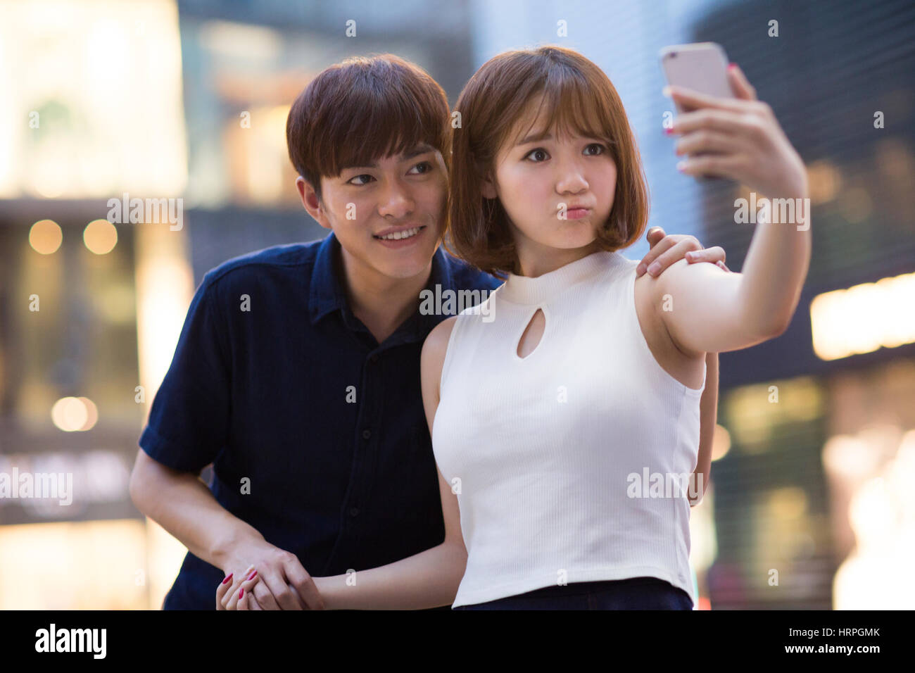 Young couple taking self portrait with smart phone Stock Photo - Alamy