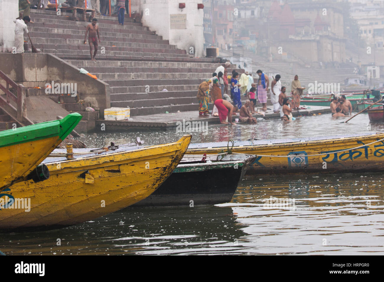 Pilgrims bathing in the early morning at Kedar ghat in Varanasi, India ...