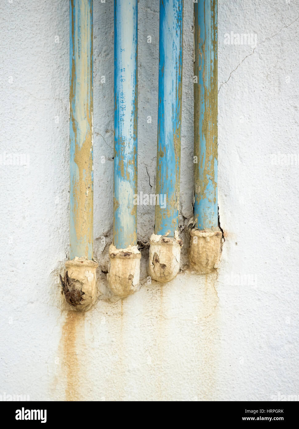 Water pipes on external wall of house in Spain Stock Photo - Alamy