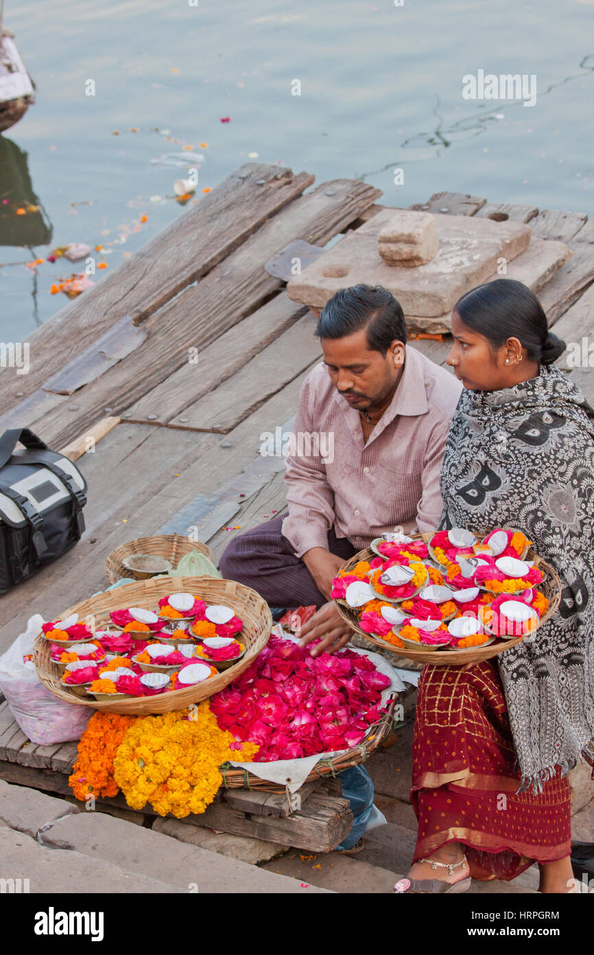 Indian traders at Varanasi on the banks of the river Ganges selling ...