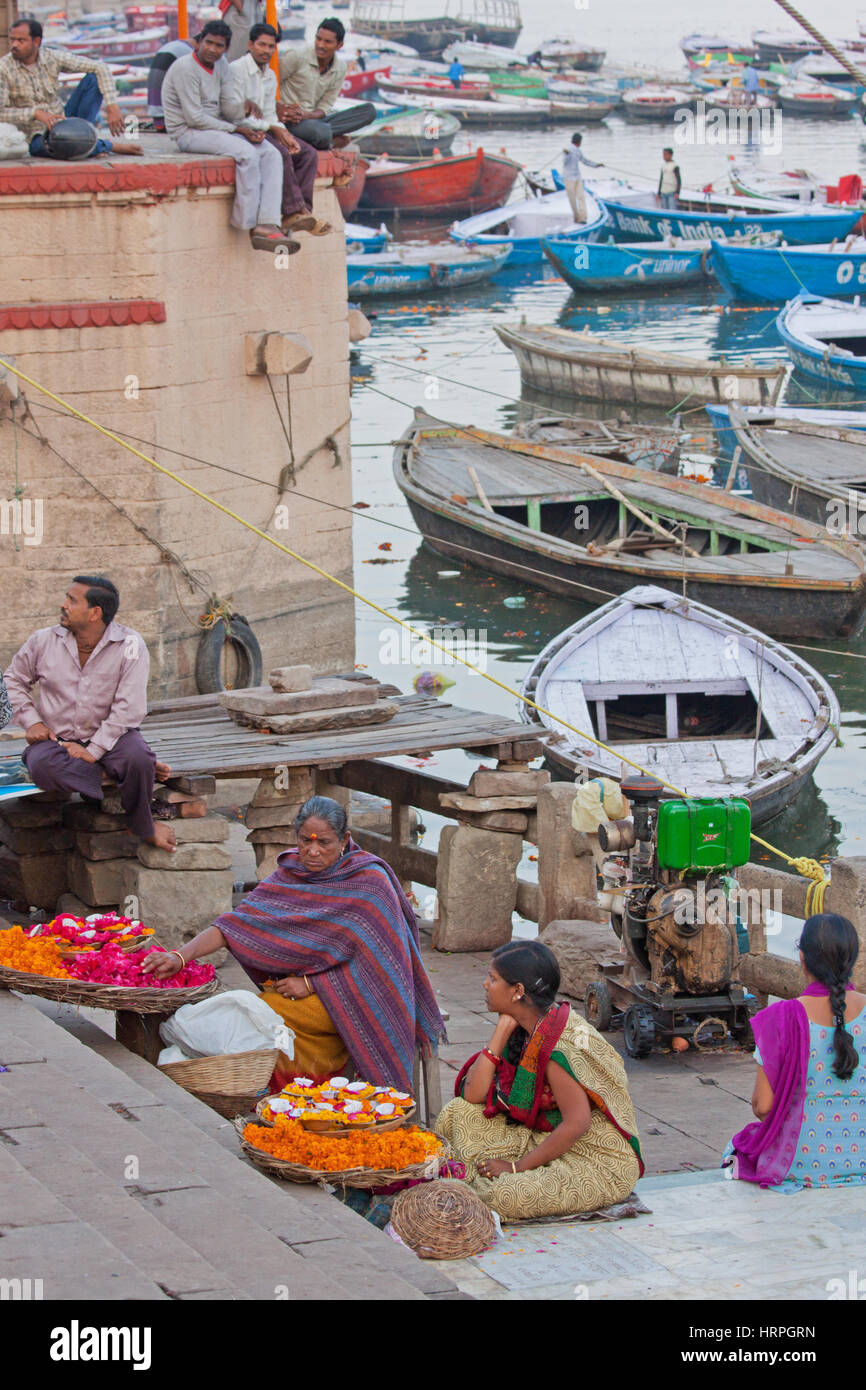 Indian traders at Varanasi on the banks of the river Ganges selling ...