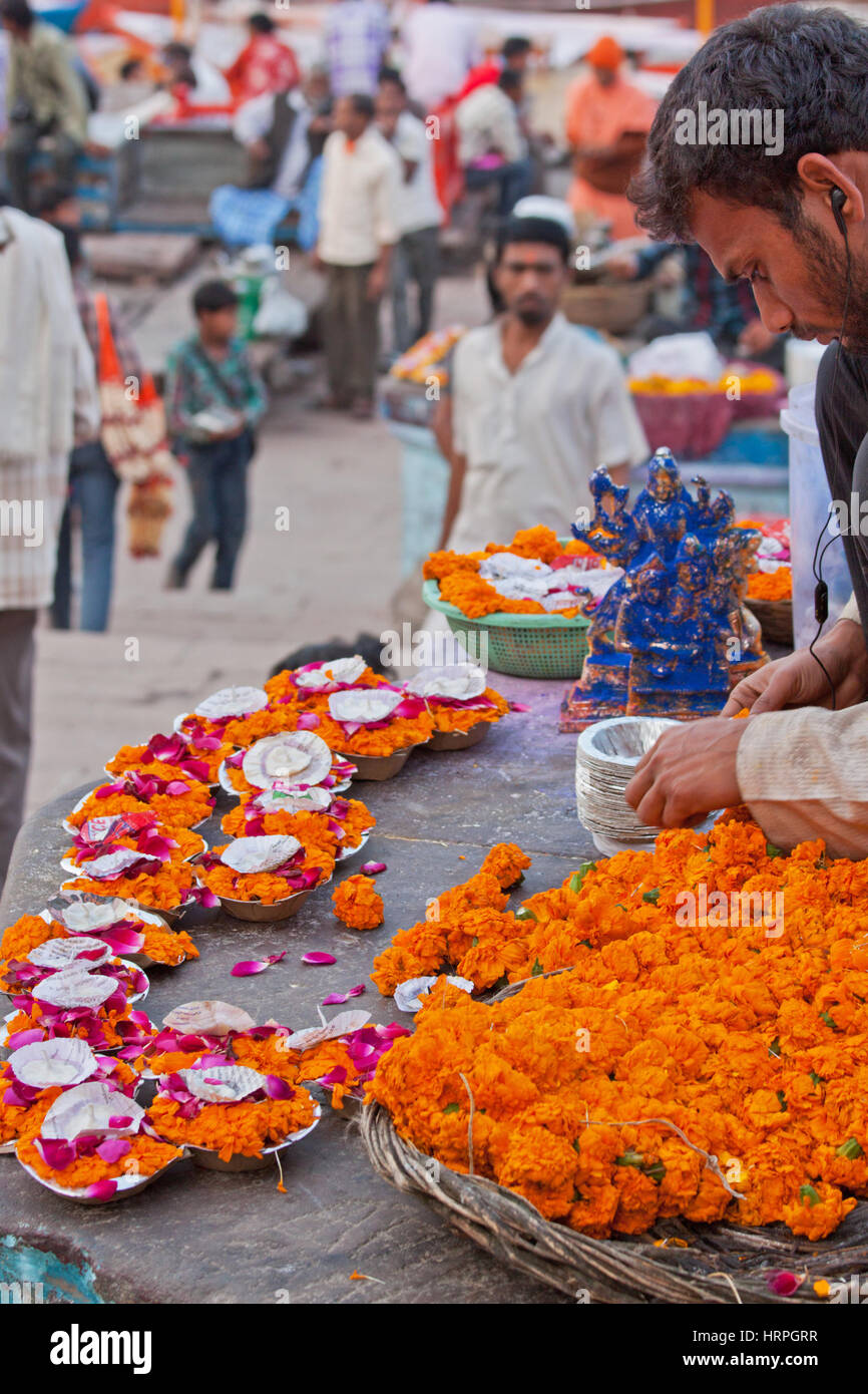 Indian trader at Varanasi on the banks of the river Ganges selling ...