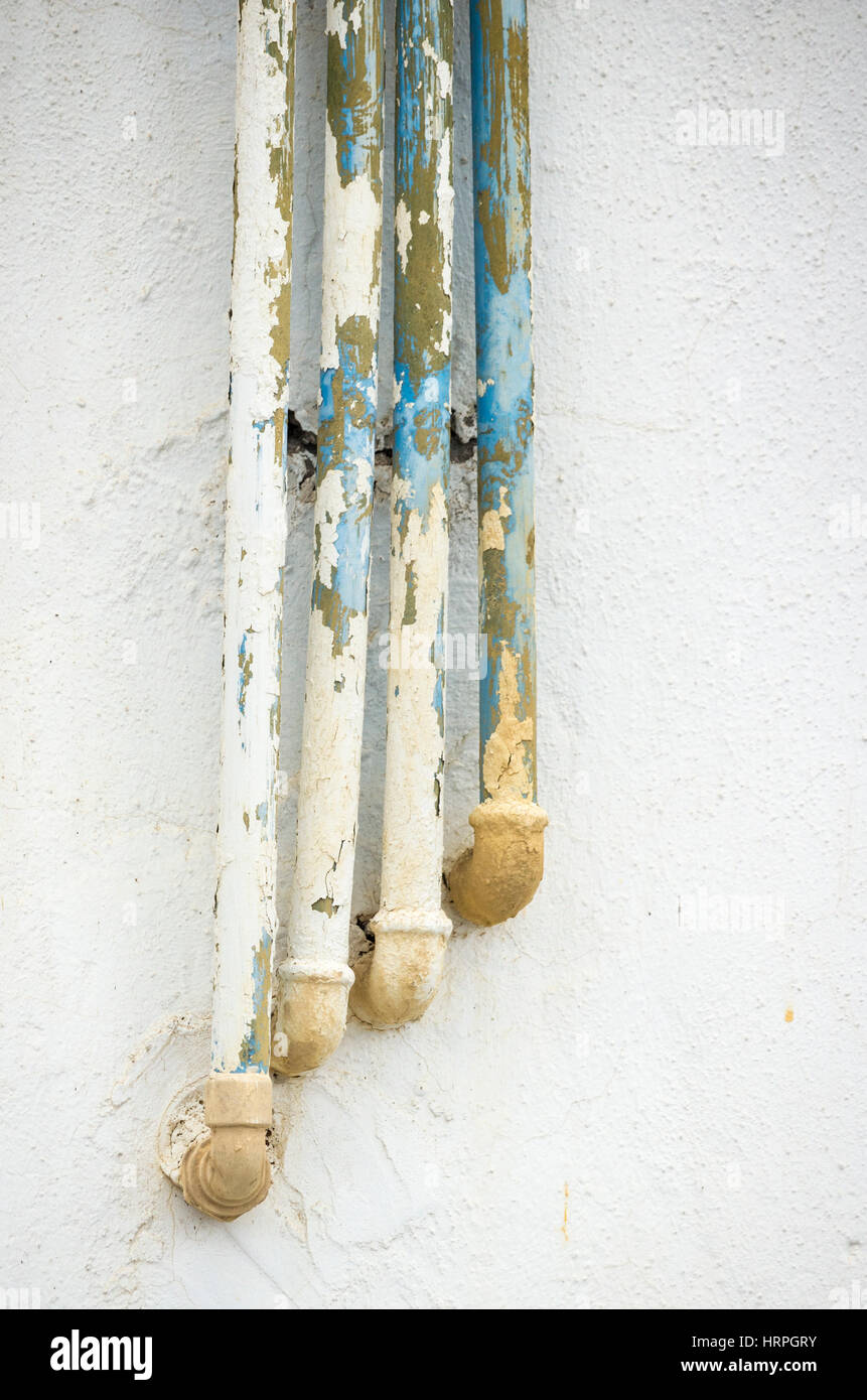 Water pipes on external wall of house in Spain Stock Photo - Alamy