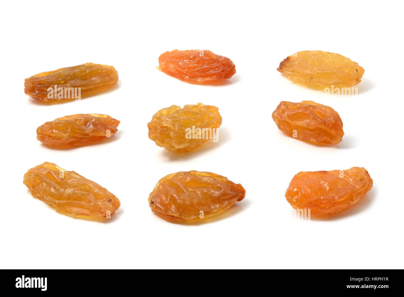 Set of yellow raisins on a white background Stock Photo - Alamy