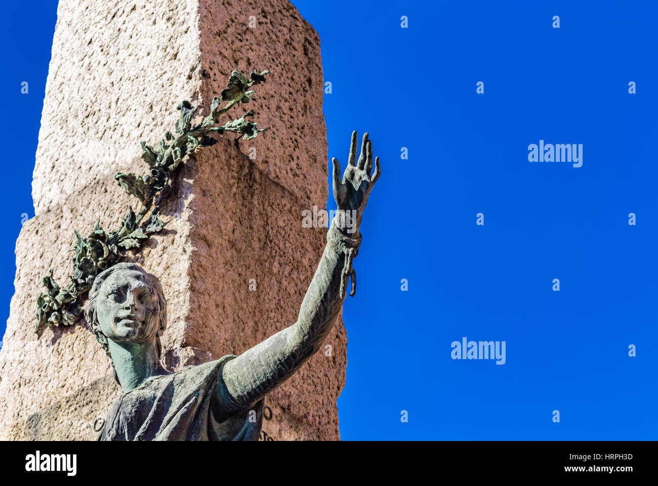 broken chain on the wrist of hand of female statue upwards raised in ...