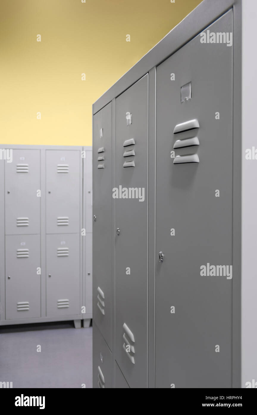 Rows of steel lockers in empty room Stock Photo - Alamy