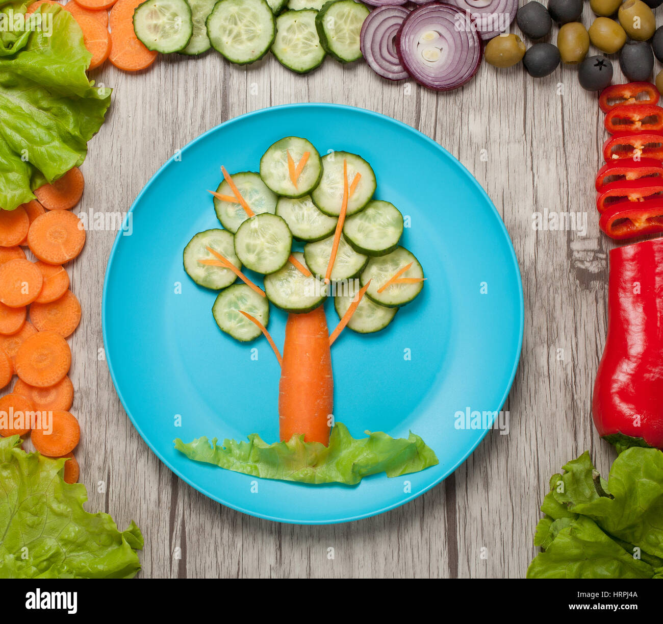Vegetable tree on plate and table with ingredients Stock Photo - Alamy