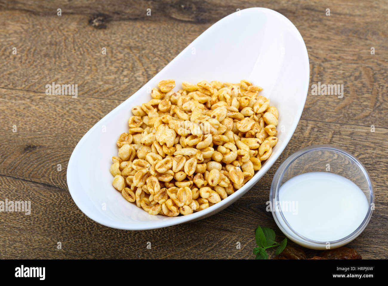 Rise flakes with milk, raisin and mint leaves Stock Photo - Alamy