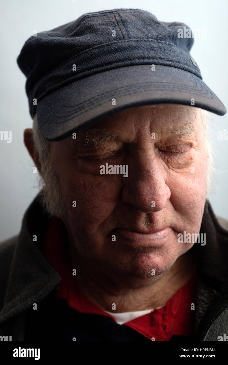 Elderly man suffering with heart failure with eyes closed Stock Photo ...