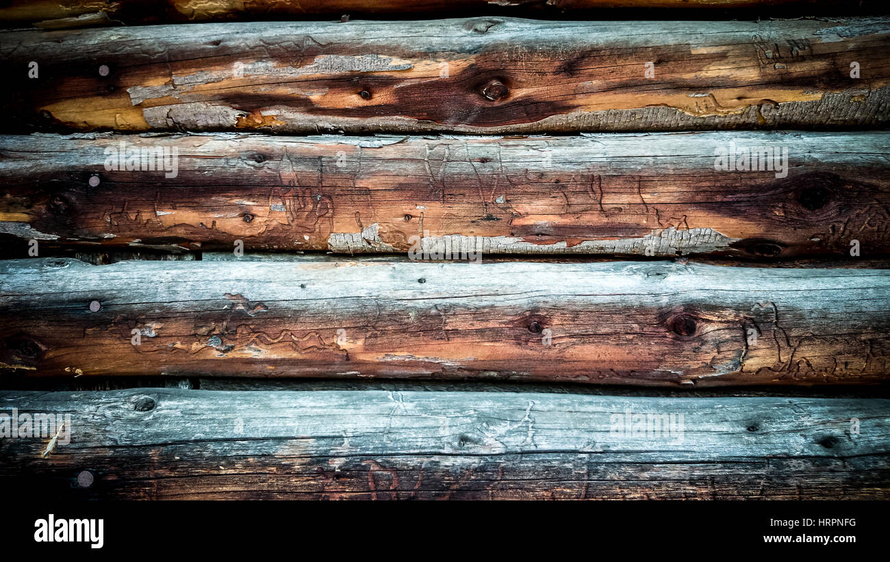 The wall of round, old logs as background Stock Photo - Alamy