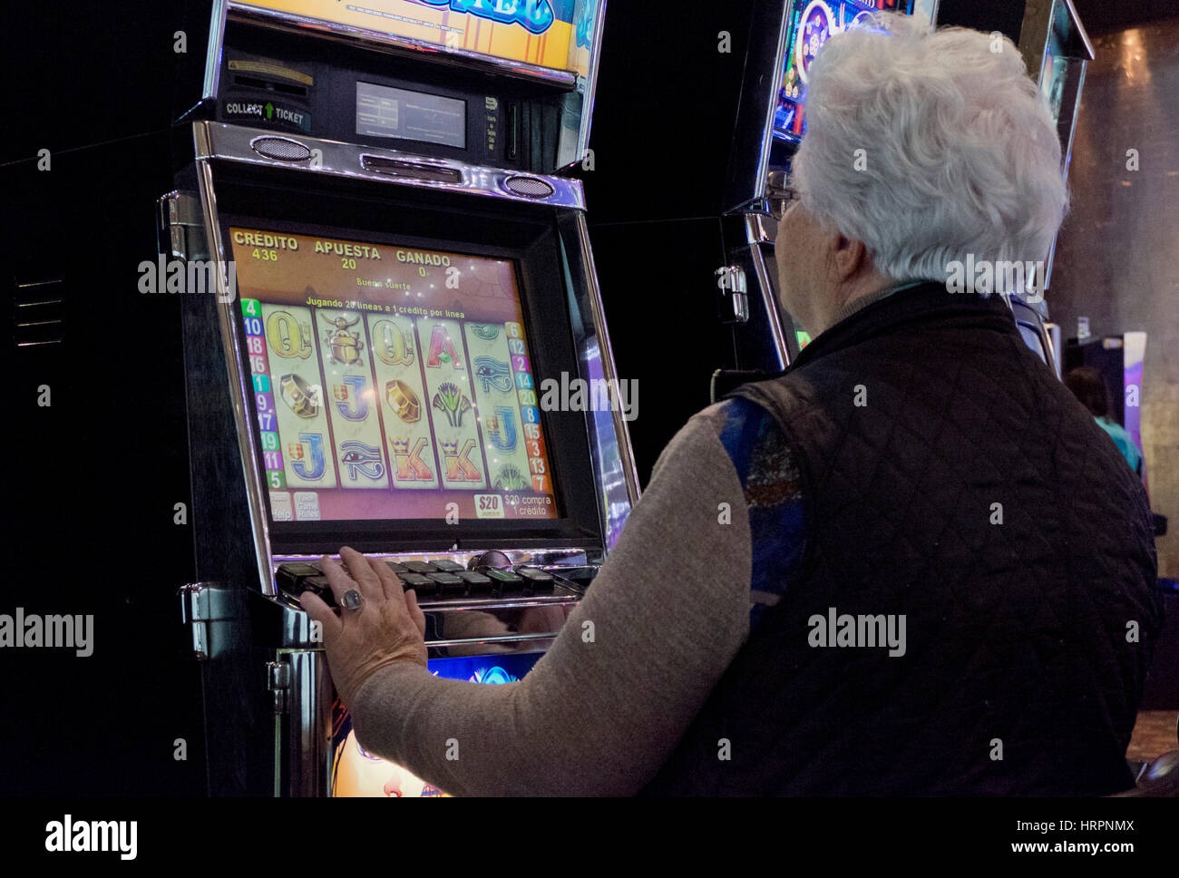 Elderly customers gambling at slot machines at a casino in Puerto Varas ...