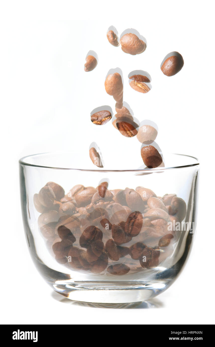 Coffee Beans Fall in a Glass Beaker Stock Photo - Alamy