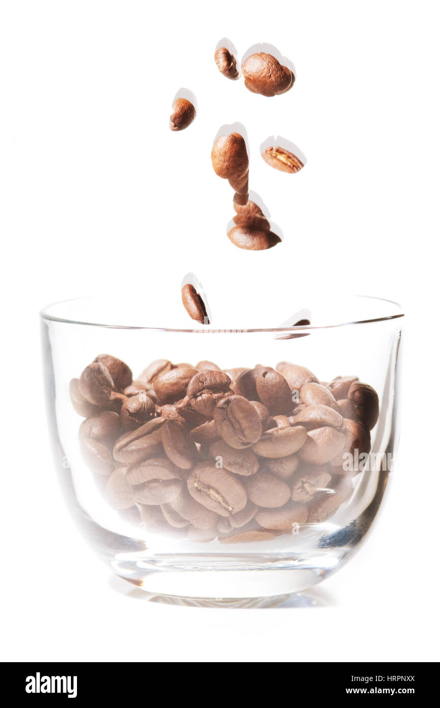 Coffee Beans Fall in a Glass Beaker Stock Photo - Alamy
