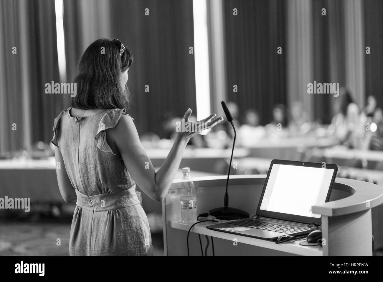 Female speaker at Business Conference and Presentation. Audience at the ...