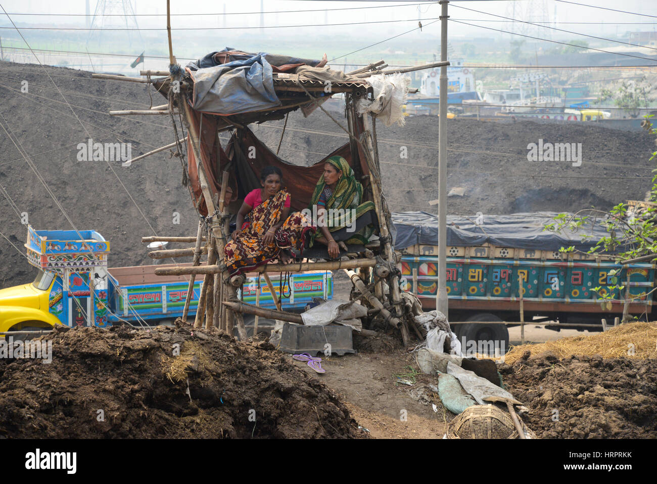 Bangladeshi women are living in the makeshift home of a next to walkway ...