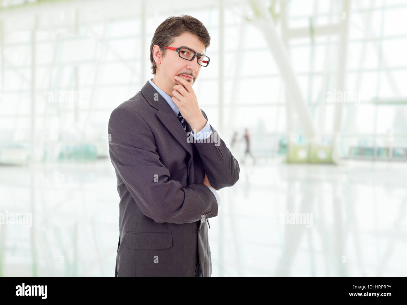 young business man thinking, at the office Stock Photo - Alamy