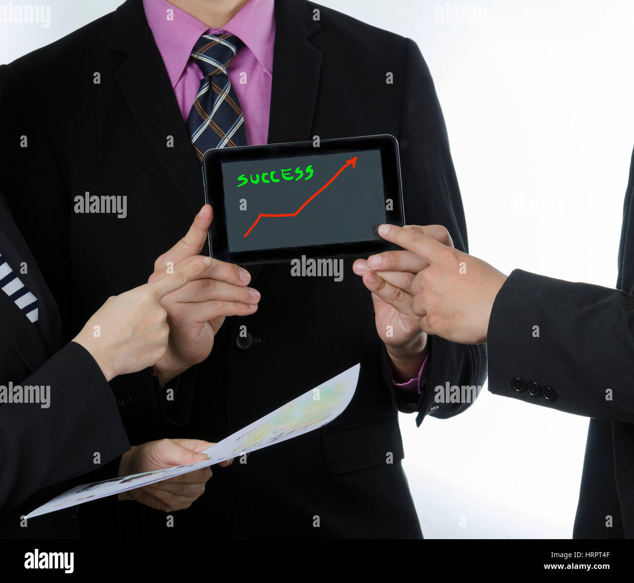 Businessman is holding touchpad written Success Concept being agreeded ...