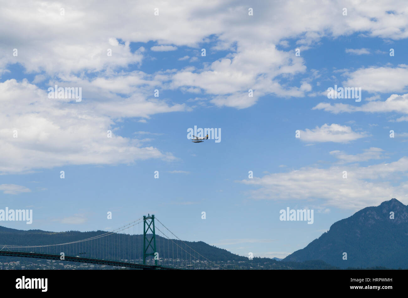 Harbour Air float plane flying over Lions Gate Bridge Stock Photo - Alamy