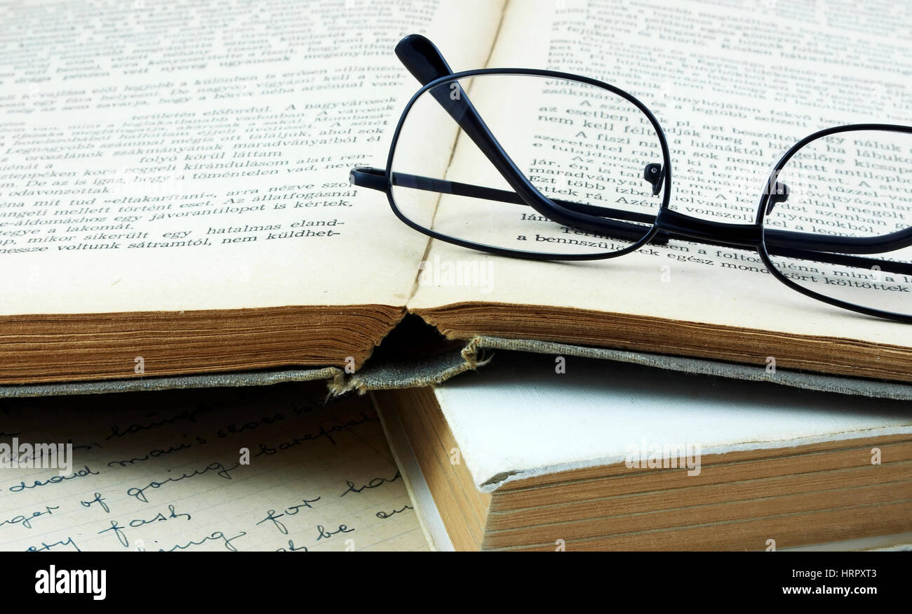 Book and glasses Stock Photo - Alamy