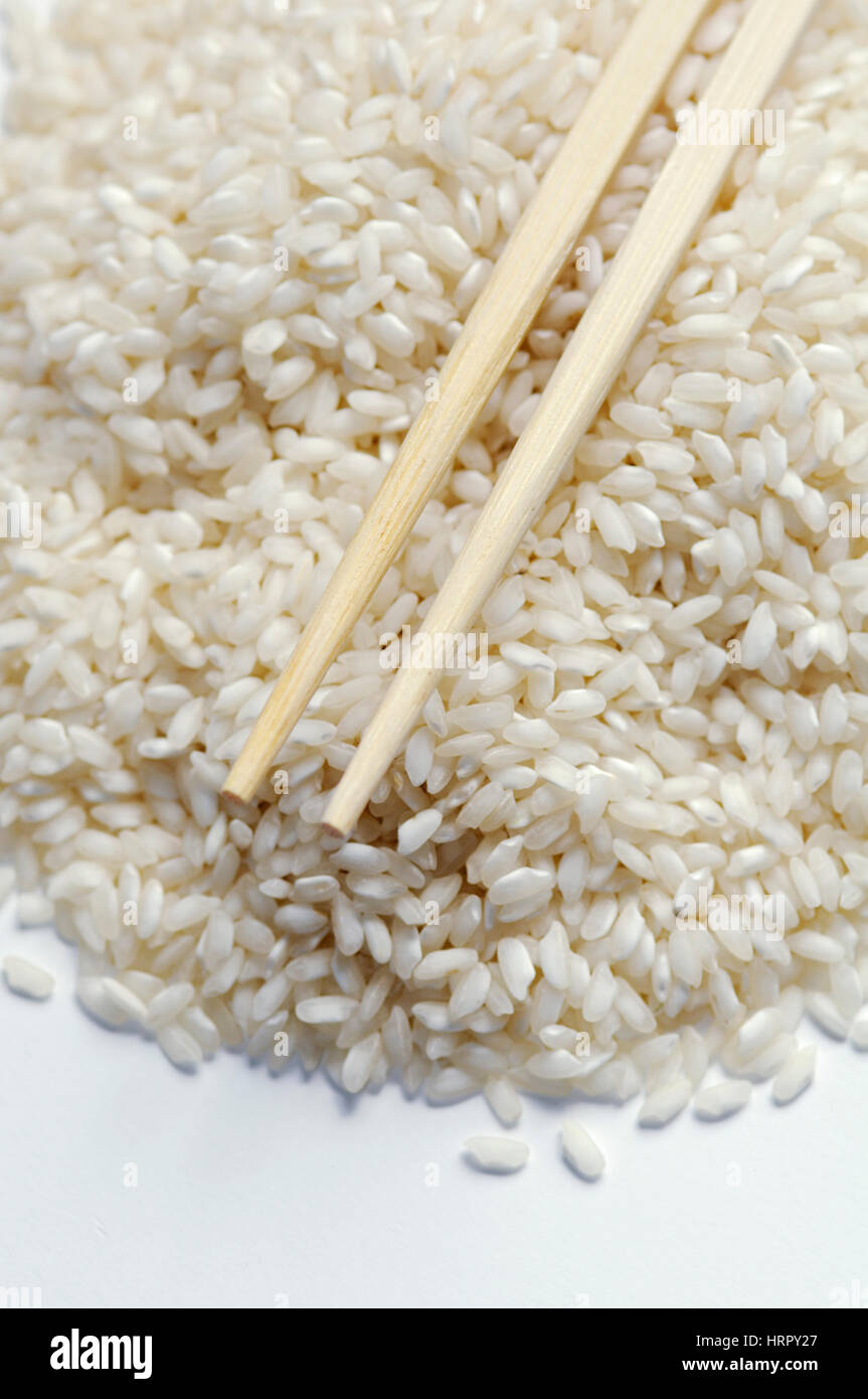 White Rice with Chopsticks Stock Photo - Alamy