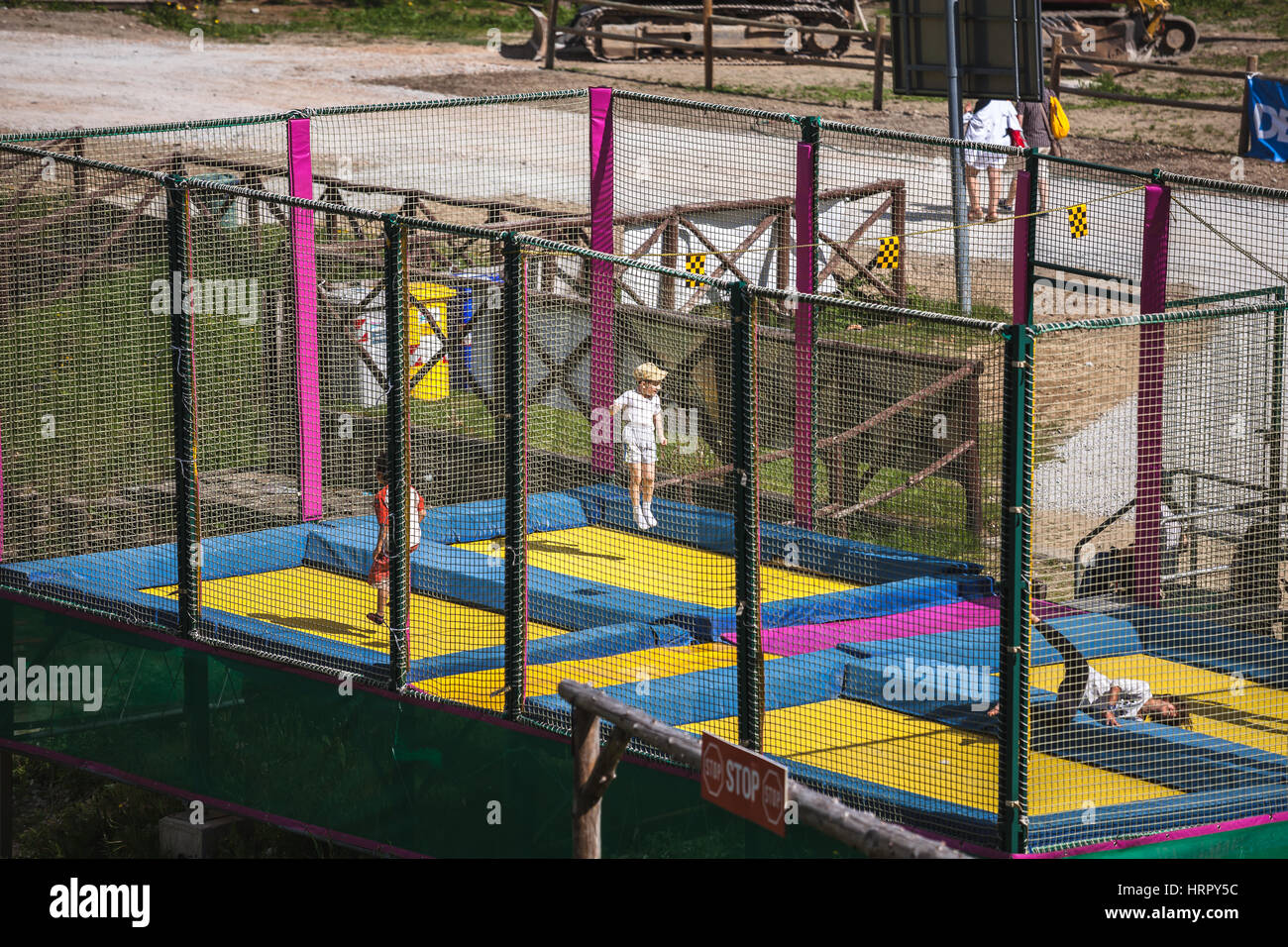 kids jumping on a big trampoline Stock Photo - Alamy