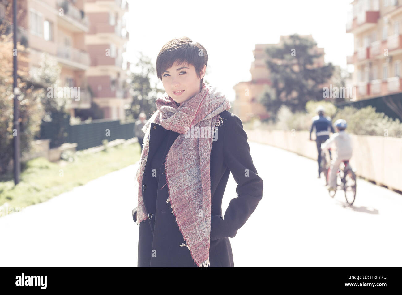 Young model woman autumnal fashion style posing outdoor on bicycle path ...