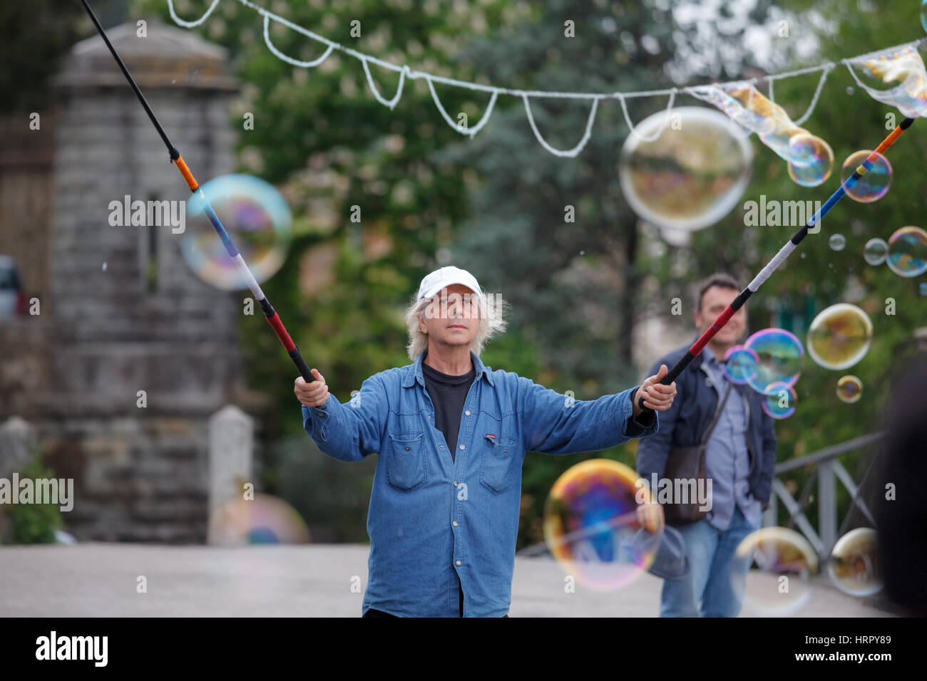 man making soap bubbles in the street Stock Photo - Alamy