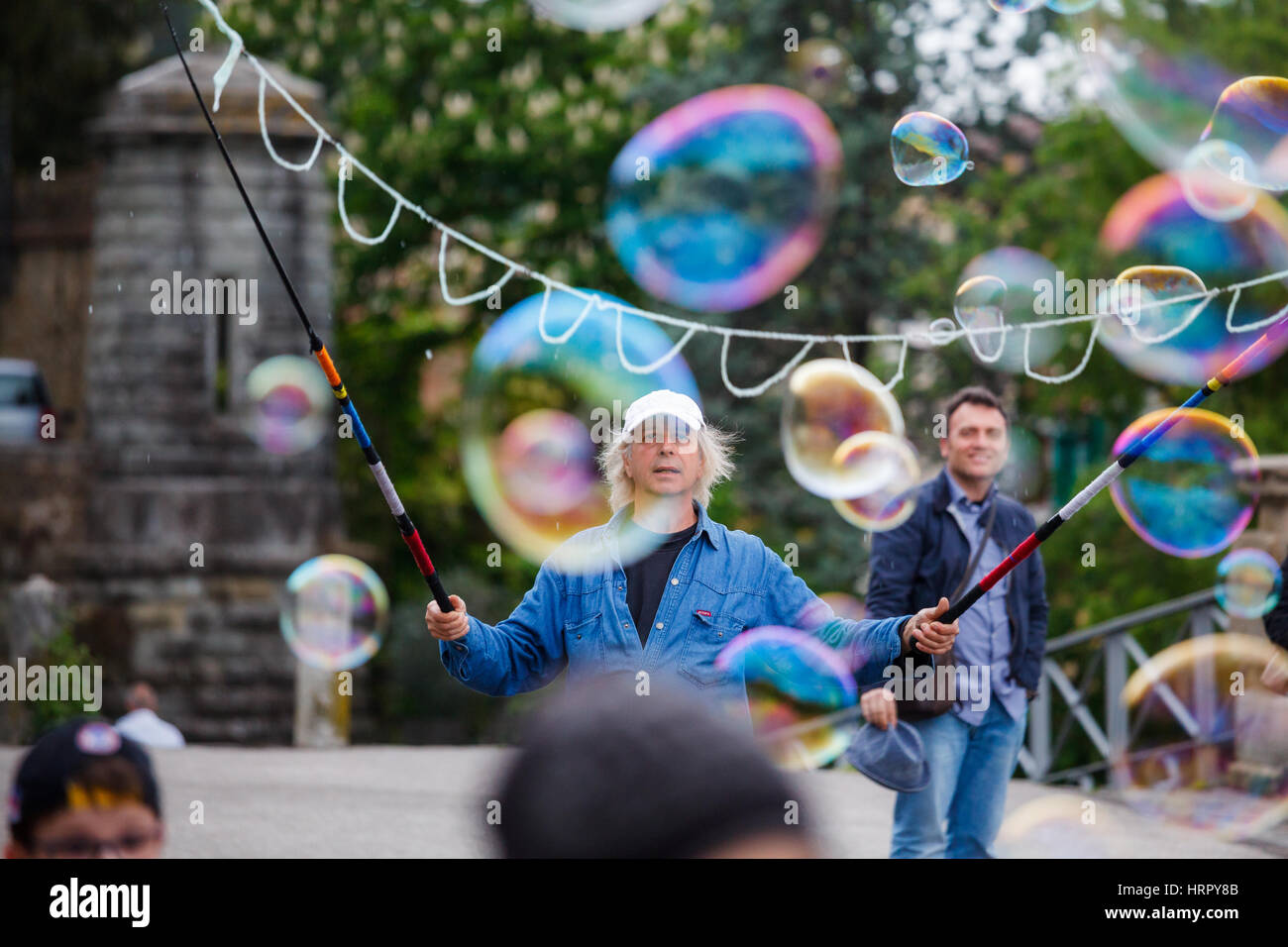 man making soap bubbles in the street Stock Photo - Alamy