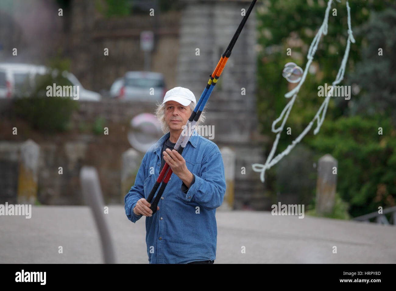 man making soap bubbles in the street Stock Photo - Alamy