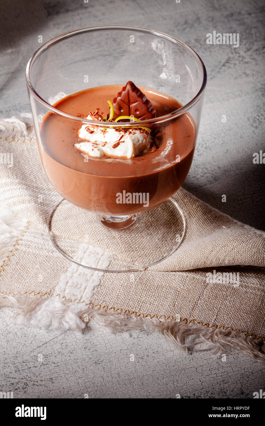 Glass with Chocolate Mousse Dessert served on a wooden surface Stock ...